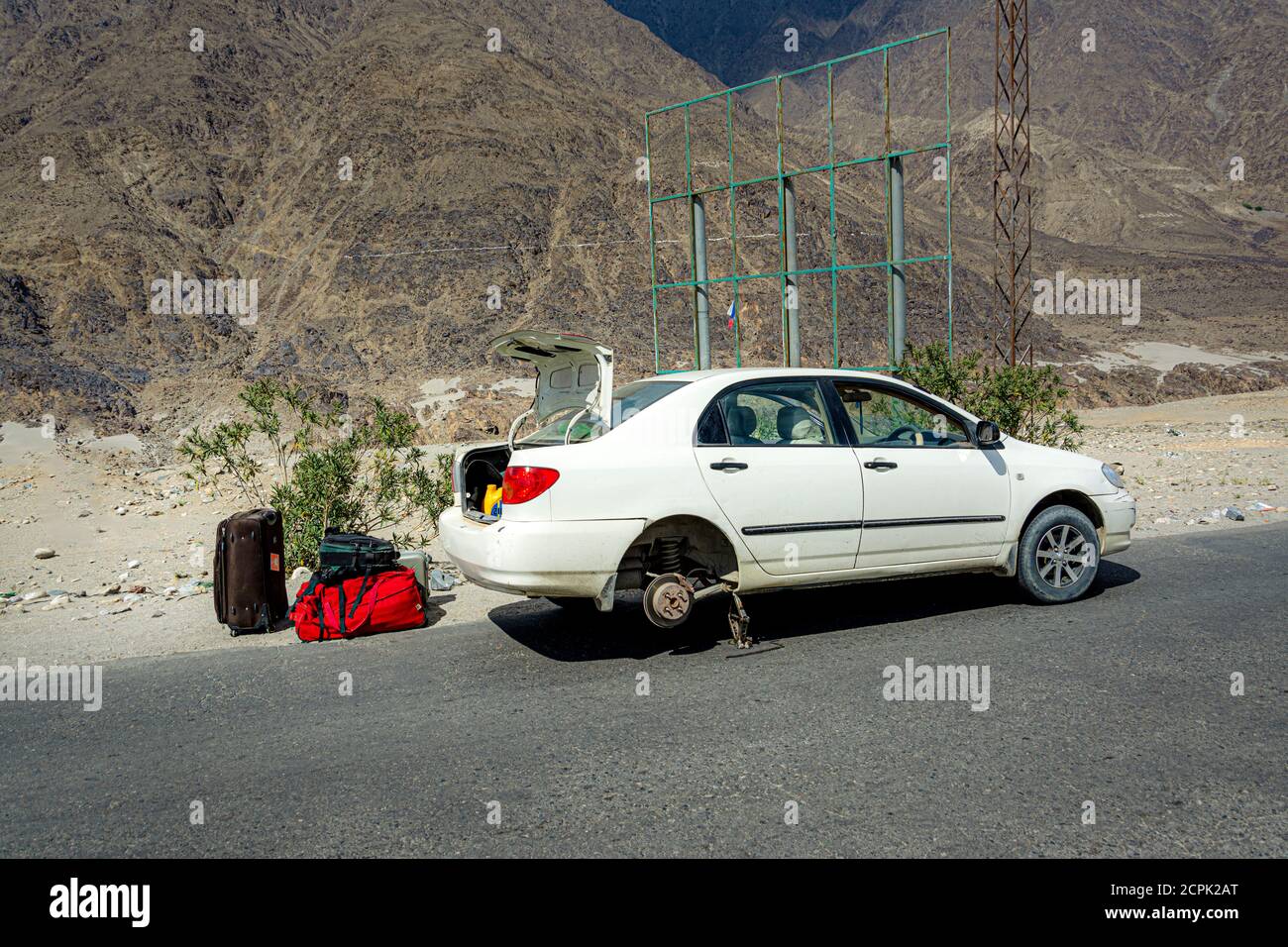 tyre flatted on the road Stock Photo - Alamy