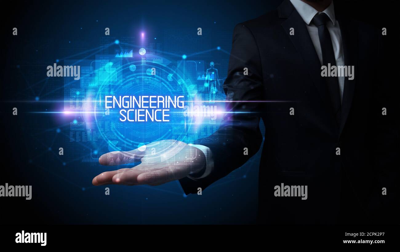 Man hand holding ENGINEERING SCIENCE inscription, technology concept ...