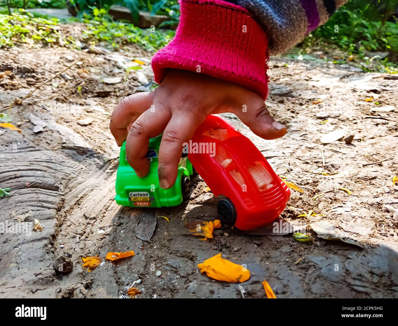 DISTRICT KATNI, INDIA - JANUARY 16, 2020: Little kid hand grabbing toy ...
