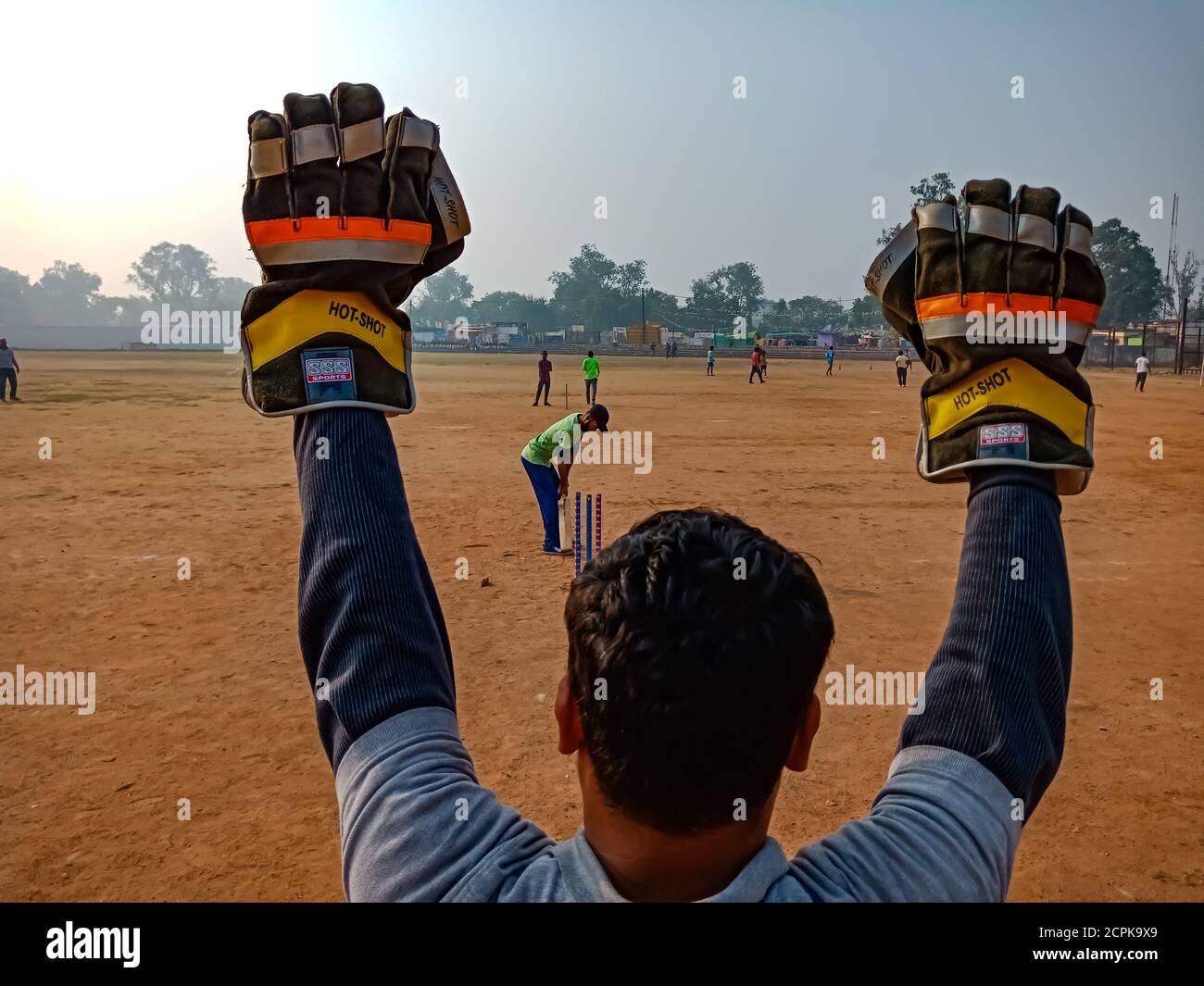 Cricket batsman raising bat hi-res stock photography and images - Alamy