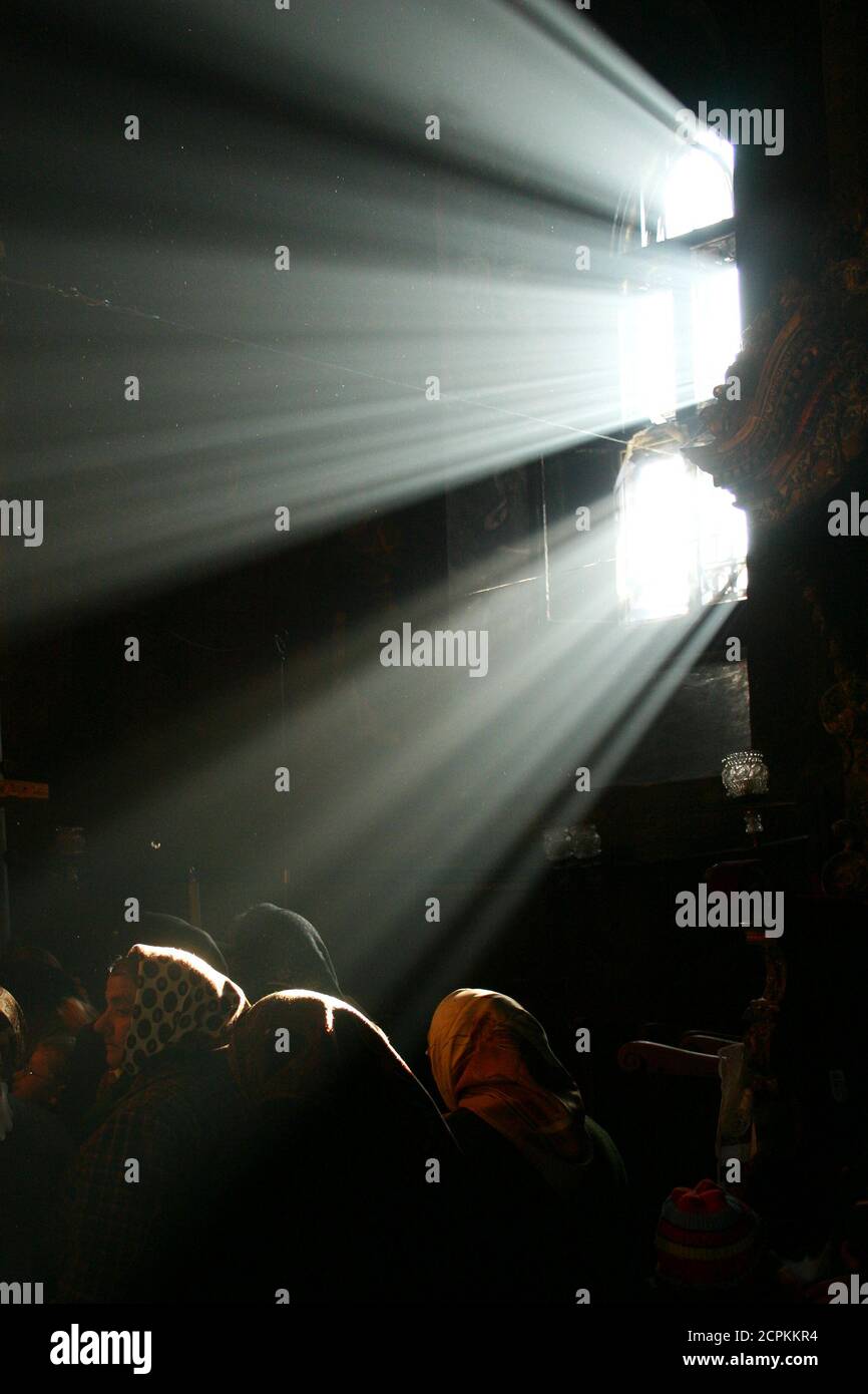 Sun rays filtered through a window inside a Christian Orthodox church ...