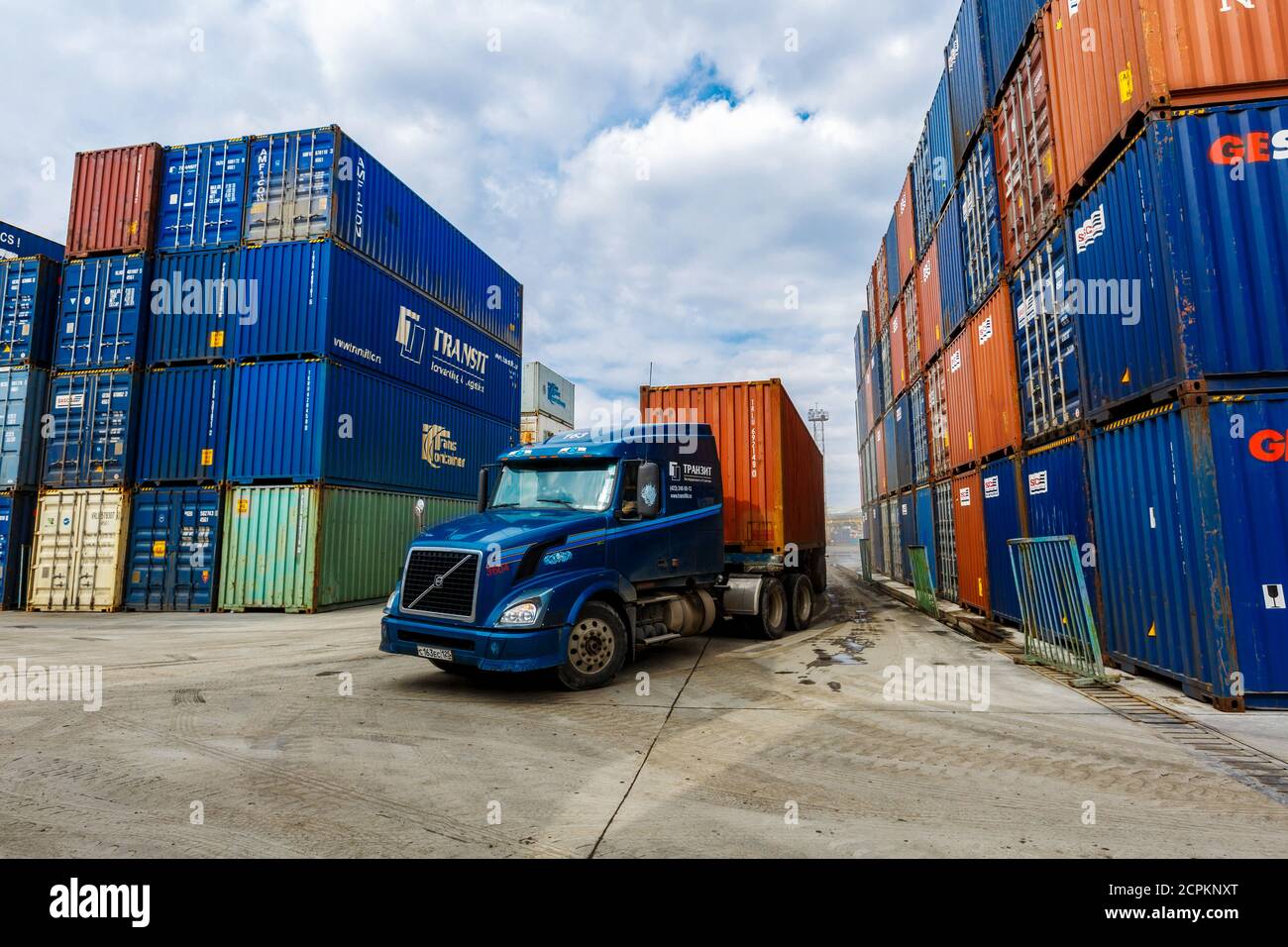 Container terminal. a lorry with a container going among even rows of ...