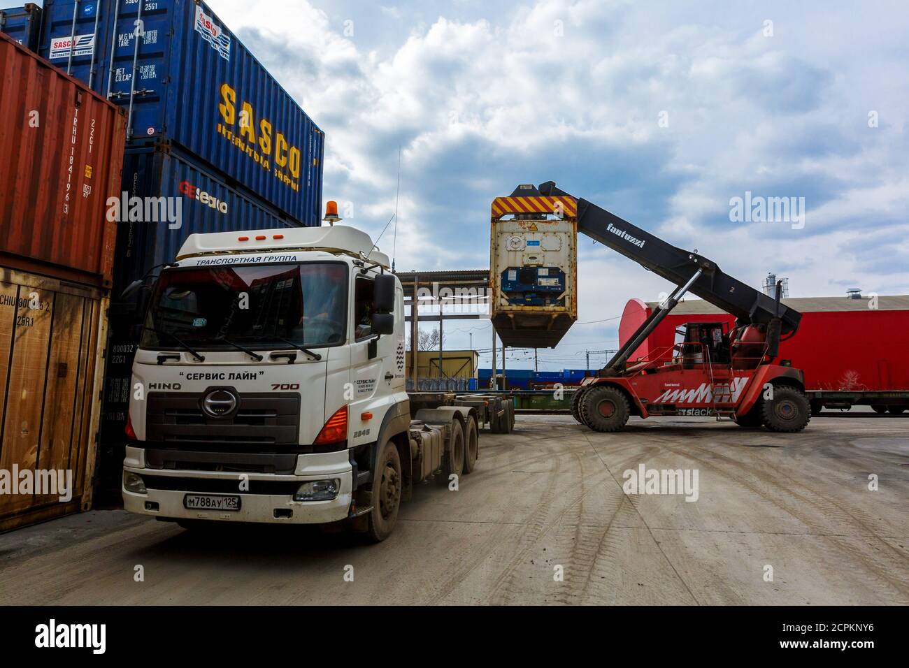 Container terminal. a lorry with a container going among even rows of ...