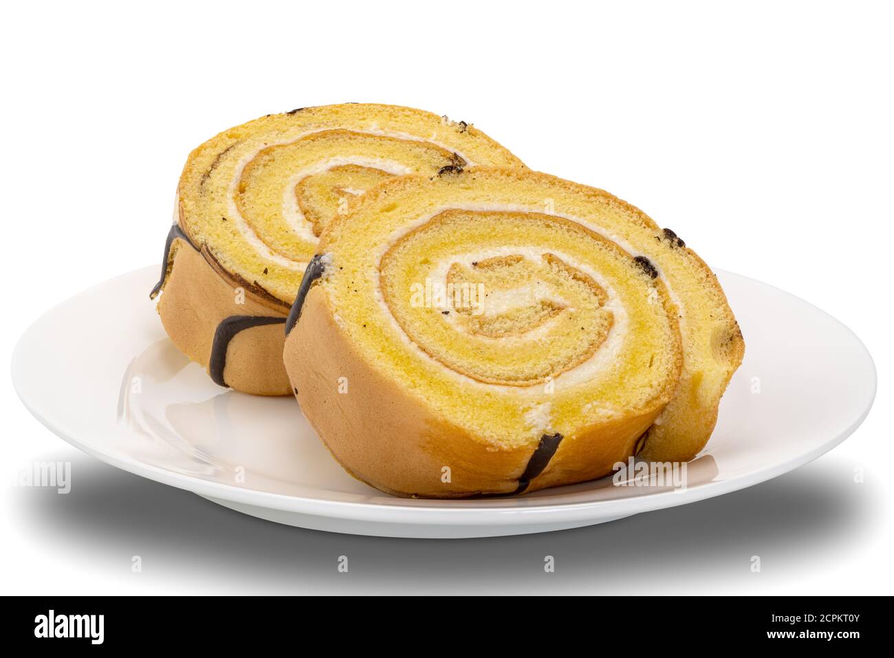 Sliced cake roll in white ceramic plate on white background with ...