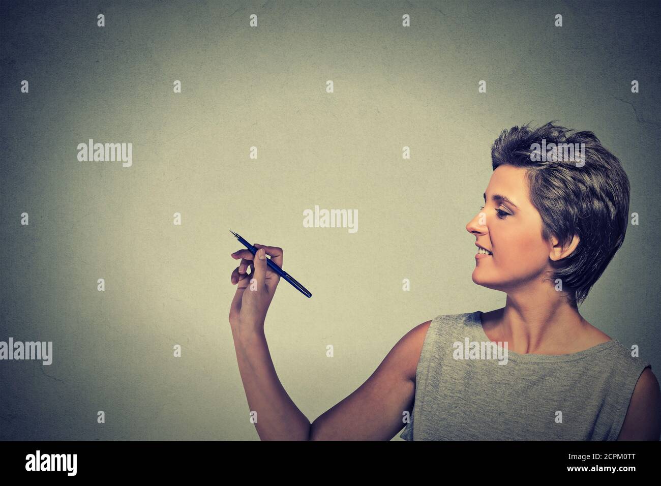 Woman writing on back board hi-res stock photography and images - Alamy