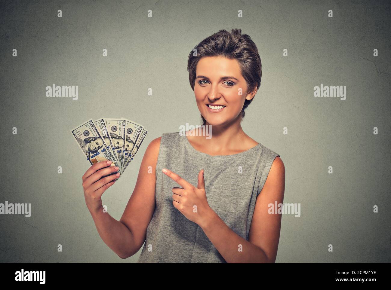 Closeup portrait super happy excited successful young woman holding ...