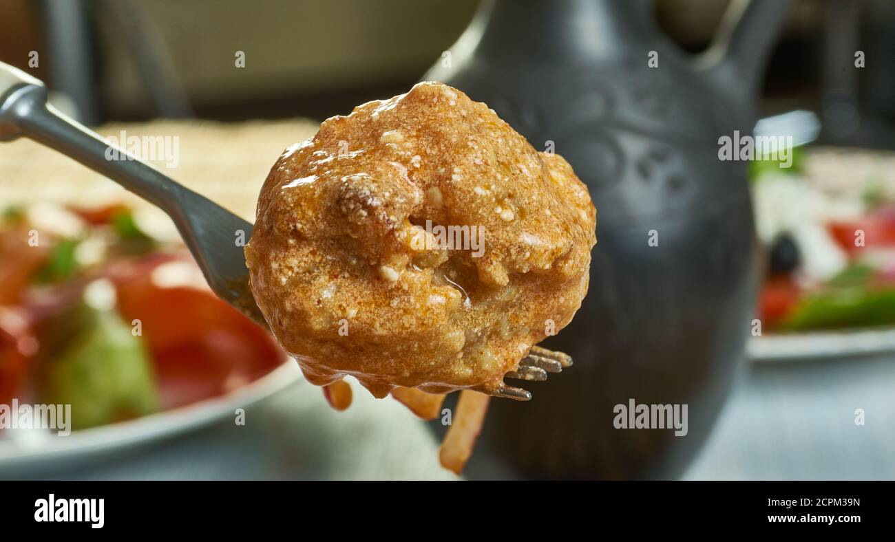 Sciusceddu - soup in Italian cuisine prepared using meatballs and ...