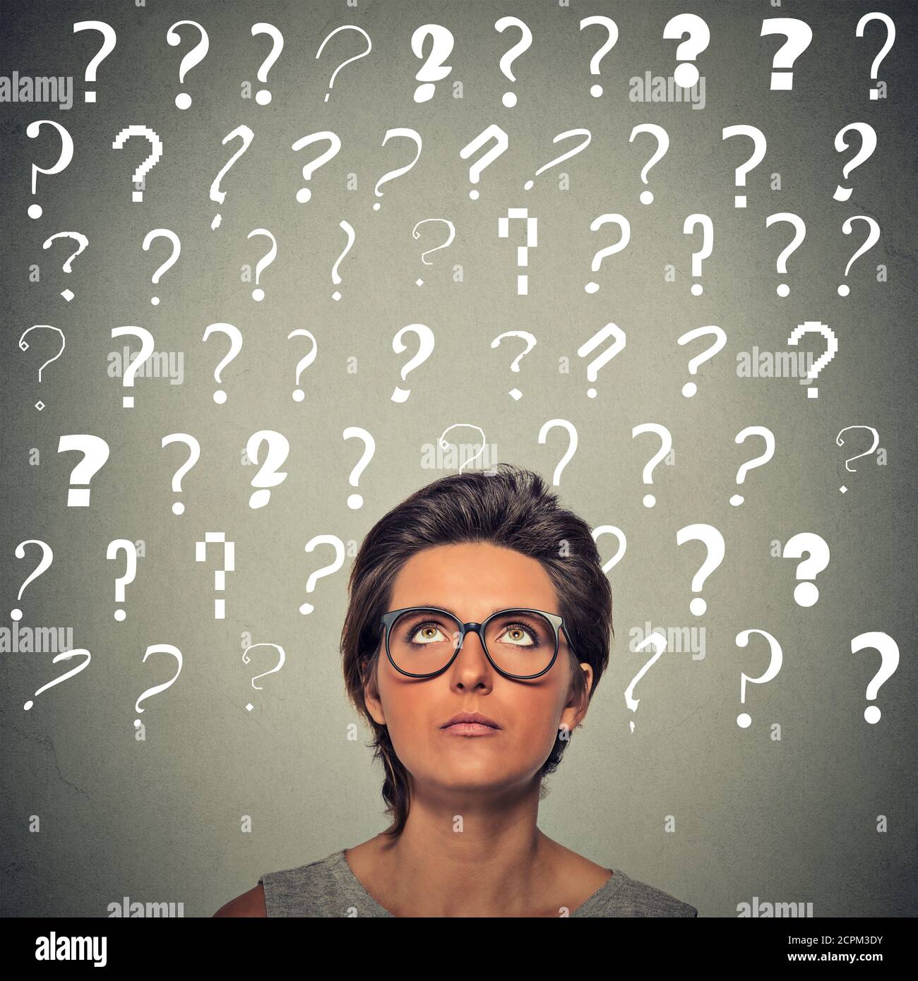 Headshot woman with puzzled face expression and question marks above ...