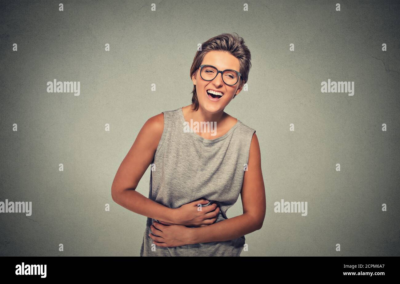 Portrait of a young woman laughing Stock Photo - Alamy