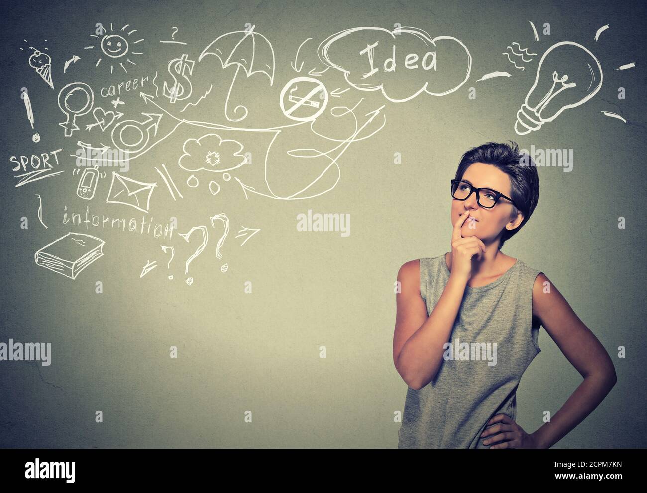 Portrait happy young woman thinking dreaming has many ideas looking up ...