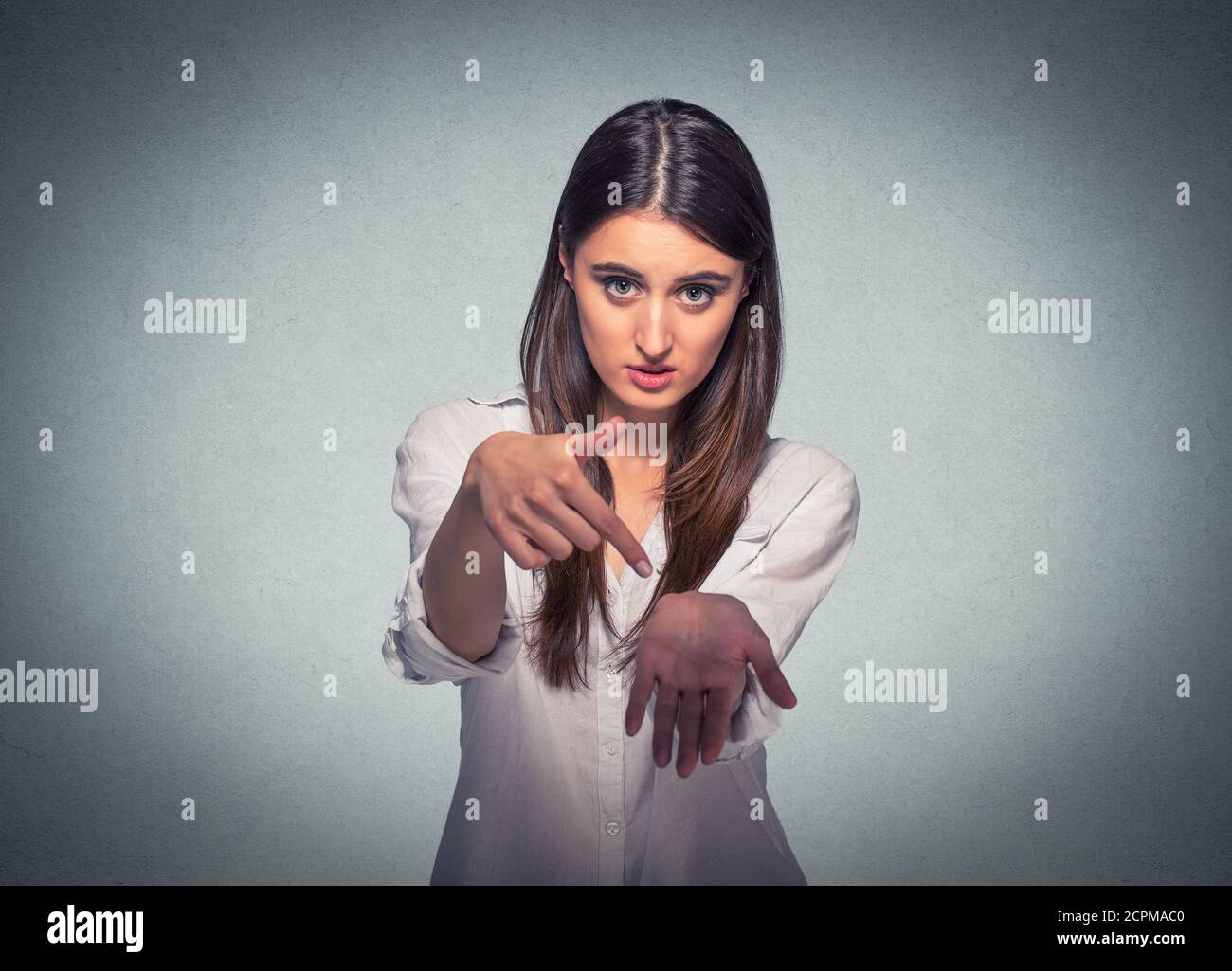 Young woman asking for more money Stock Photo - Alamy