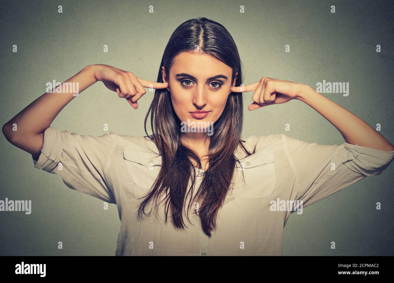 Woman Plugging Ears High Resolution Stock Photography and Images - Alamy