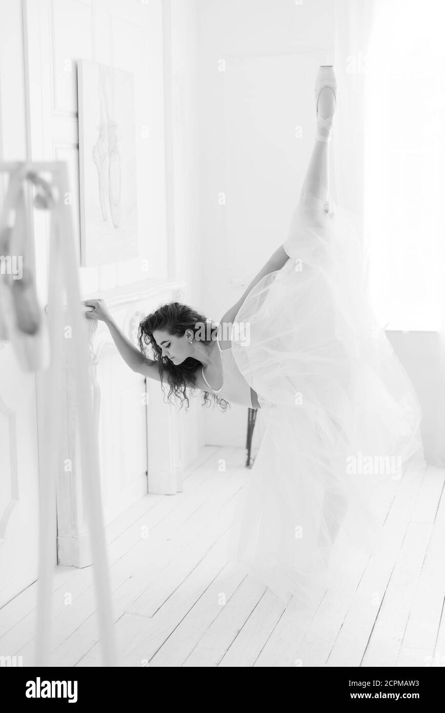 Girl ballerina with curly hair. Black and white photo. BW Stock Photo - Alamy