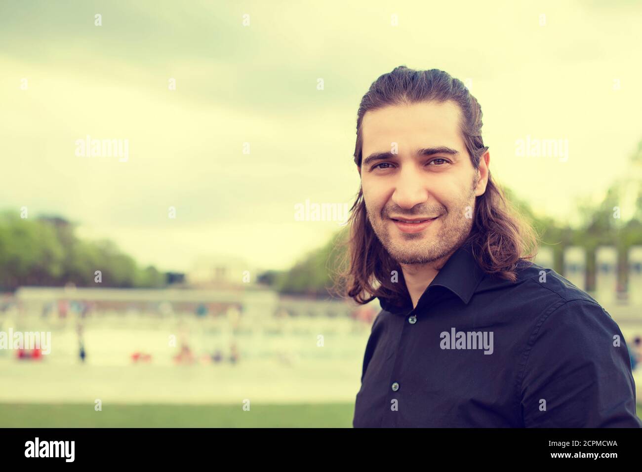 Headshot portrait of young man smiling isolated on outside outdoors ...