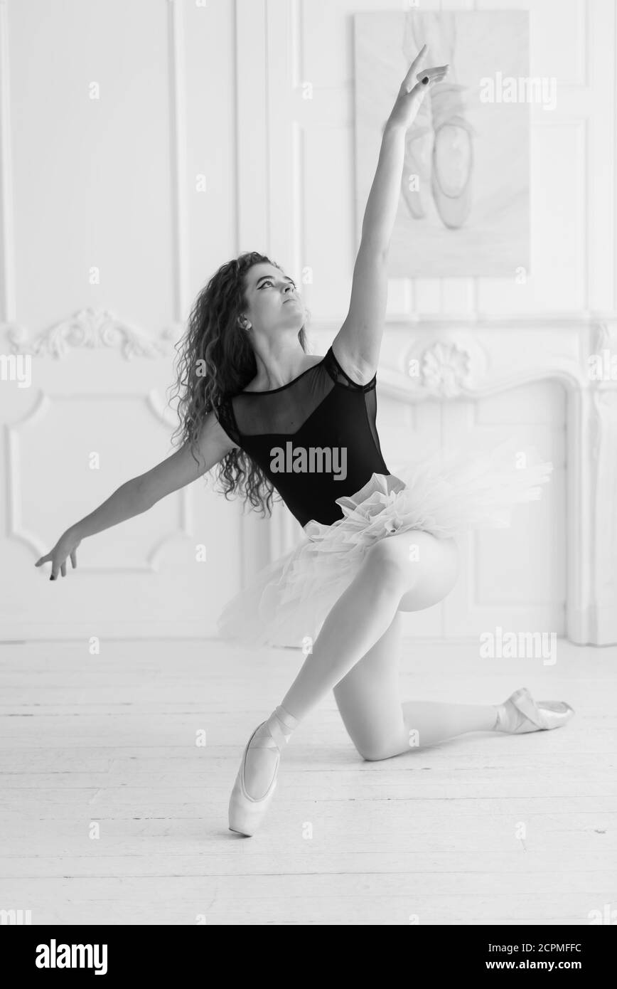 Girl ballerina with curly hair. Black and white photo. BW Stock Photo - Alamy