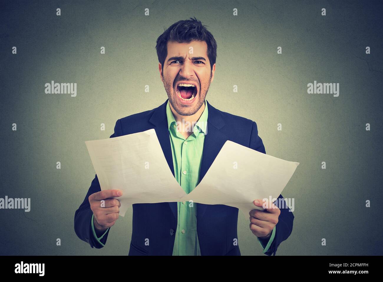 Angry stressed screaming business man with documents papers paperwork ...