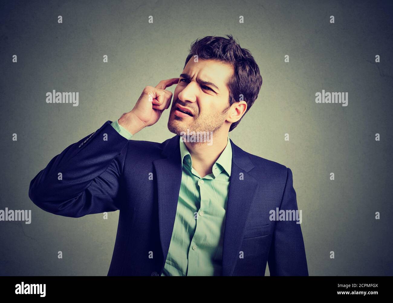 Confused business man thinking scratching his head Stock Photo - Alamy