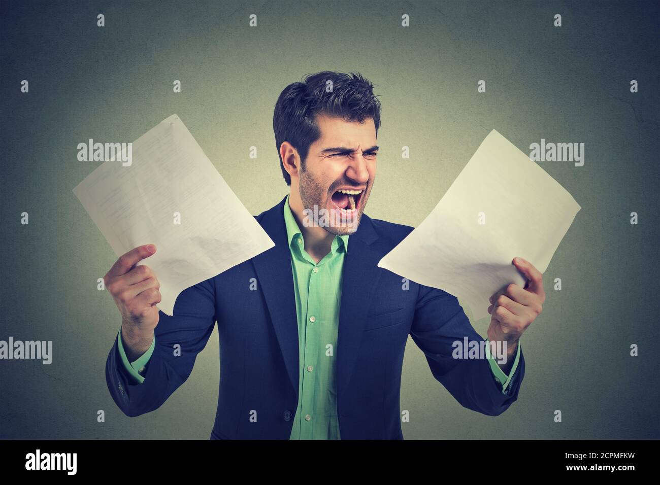 Angry stressed screaming business man with documents papers paperwork ...