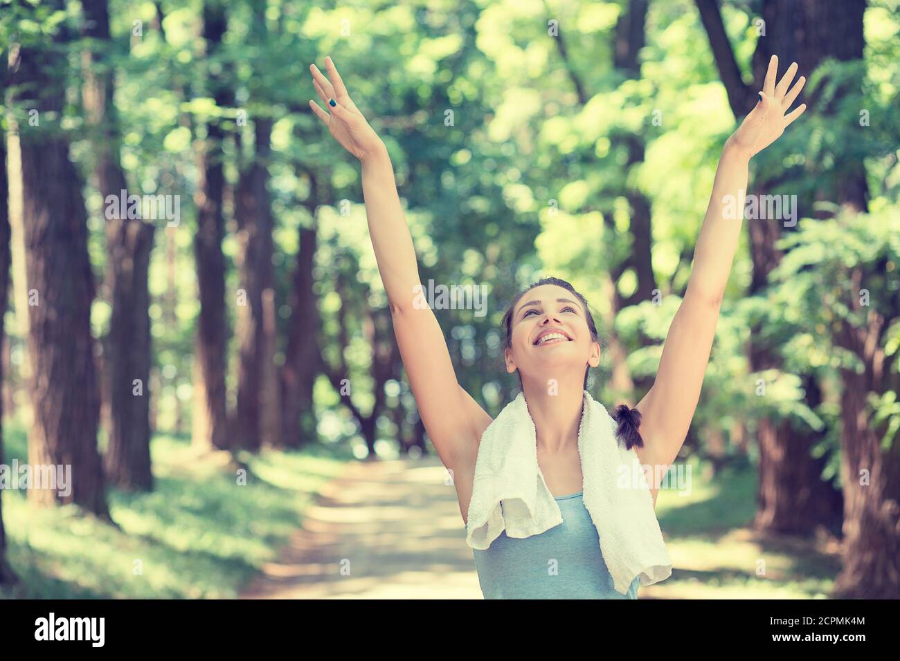 Young fit woman arms raised up to sky celebrating freedom. Positive ...