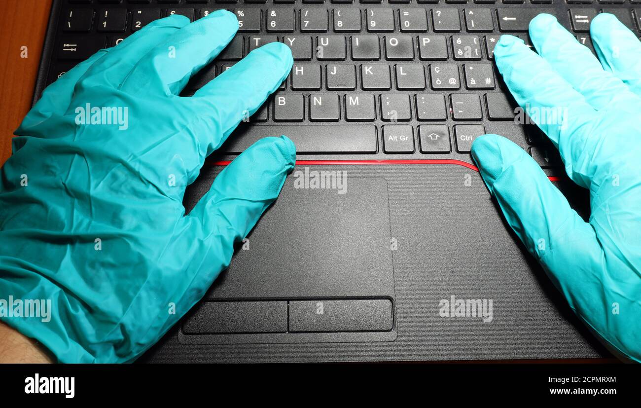 hands of doctor in hospital while writing hospital report on computer ...