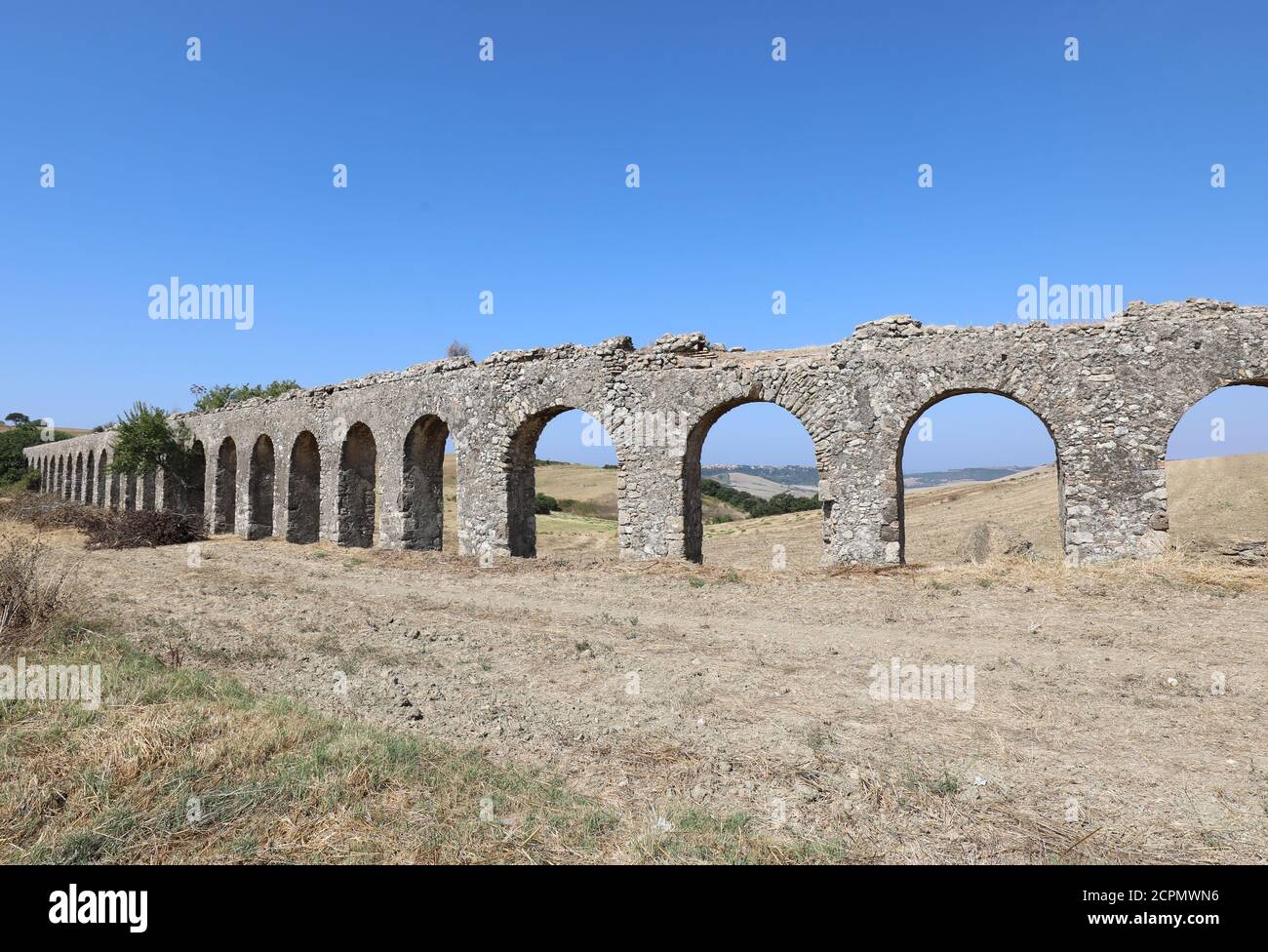 ancient aqueduct made with stones and arches to bring water to the ...