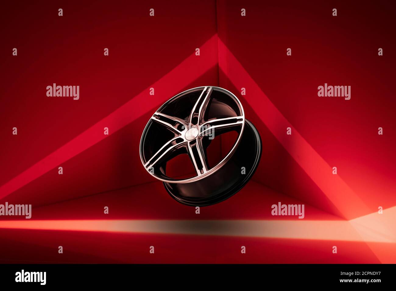 the rim is a modern sports alloy wheels, on a bright red background ...