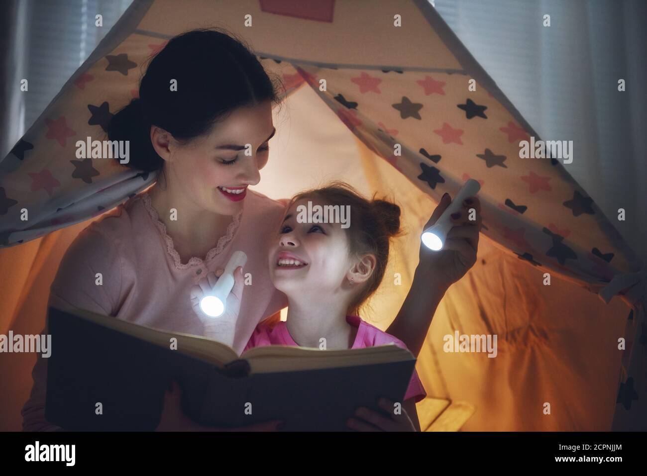 Two children bedtime story lamp hi-res stock photography and images - Alamy