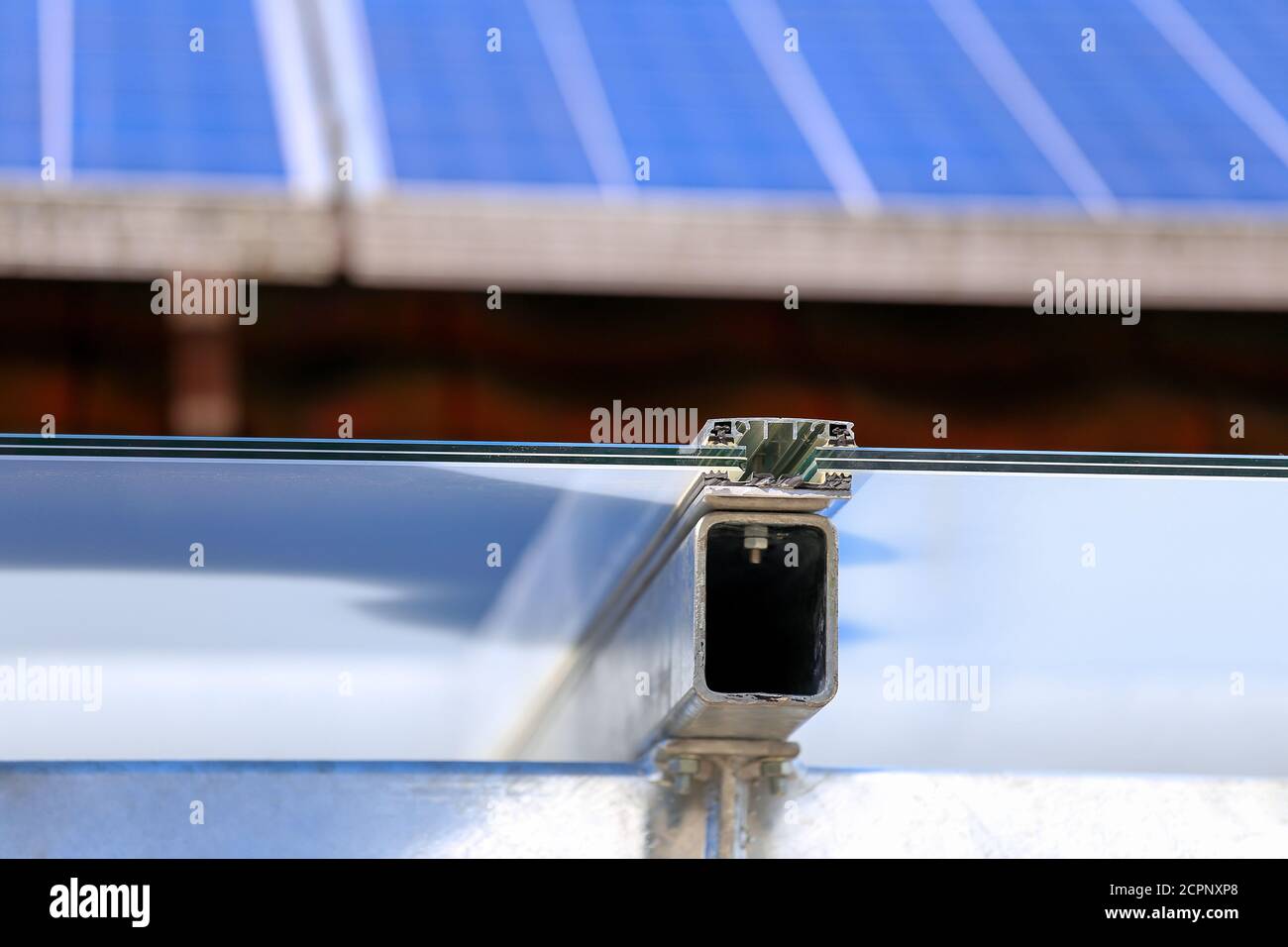 Installation of a glass roof for the terrace Stock Photo - Alamy