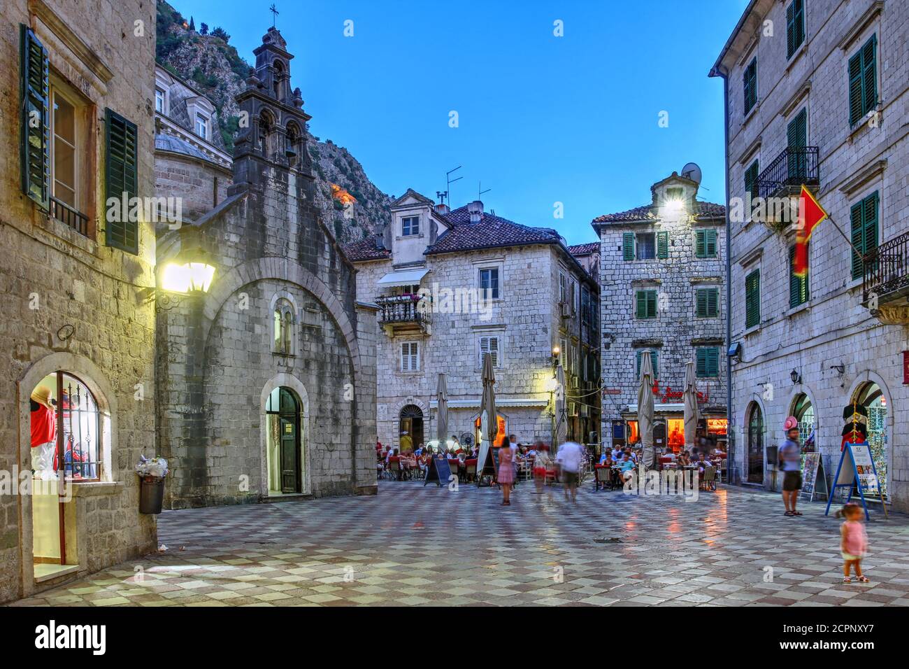 Scene in the medieval town of Kotor, Montenegro at twilight, featuring ...
