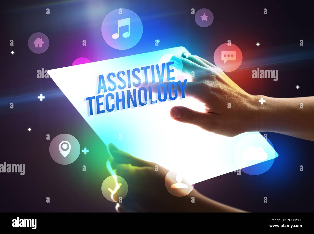Holding futuristic tablet with ASSISTIVE TECHNOLOGY inscription, new ...