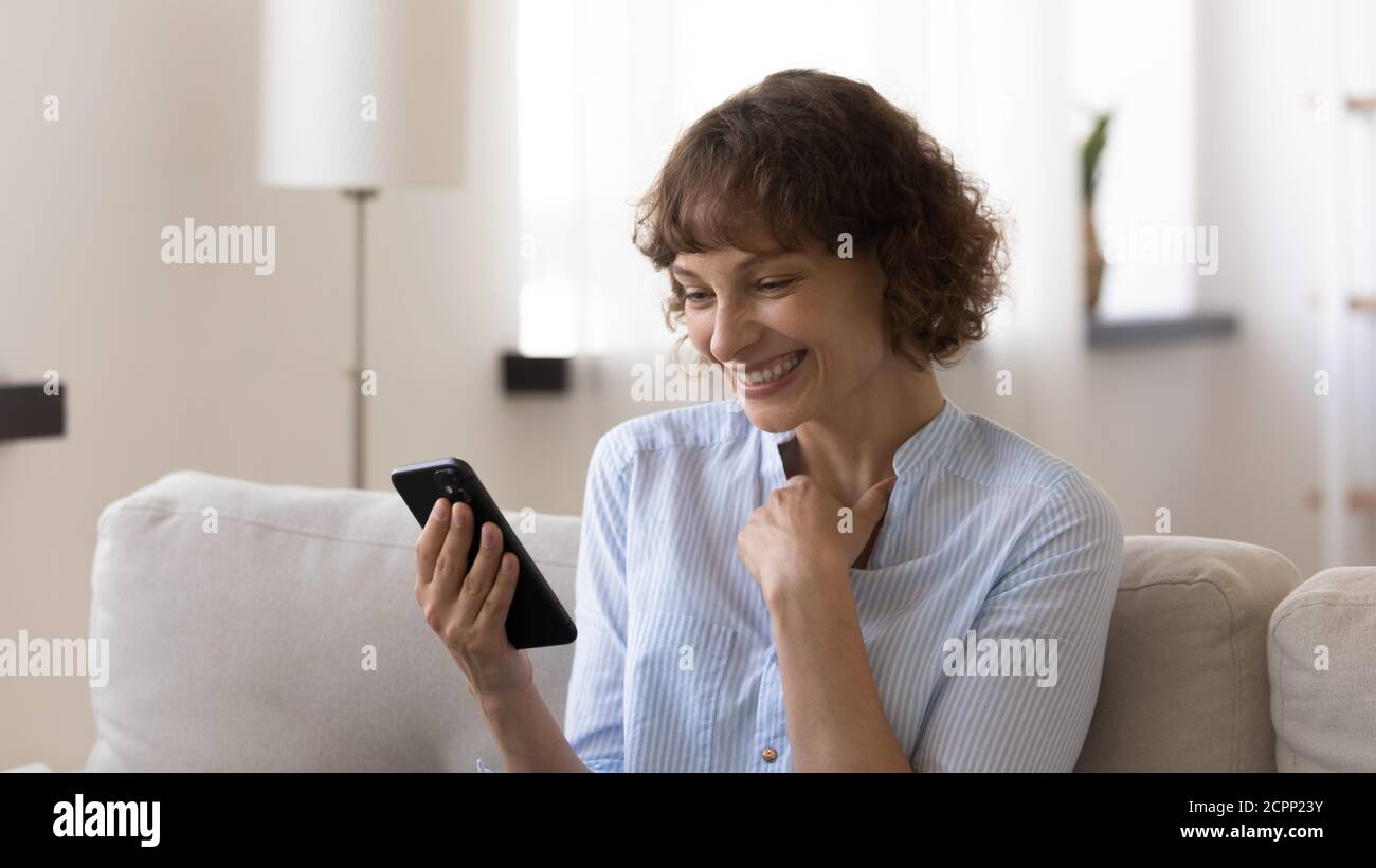 Woman smile reading in hi-res stock photography and images - Alamy