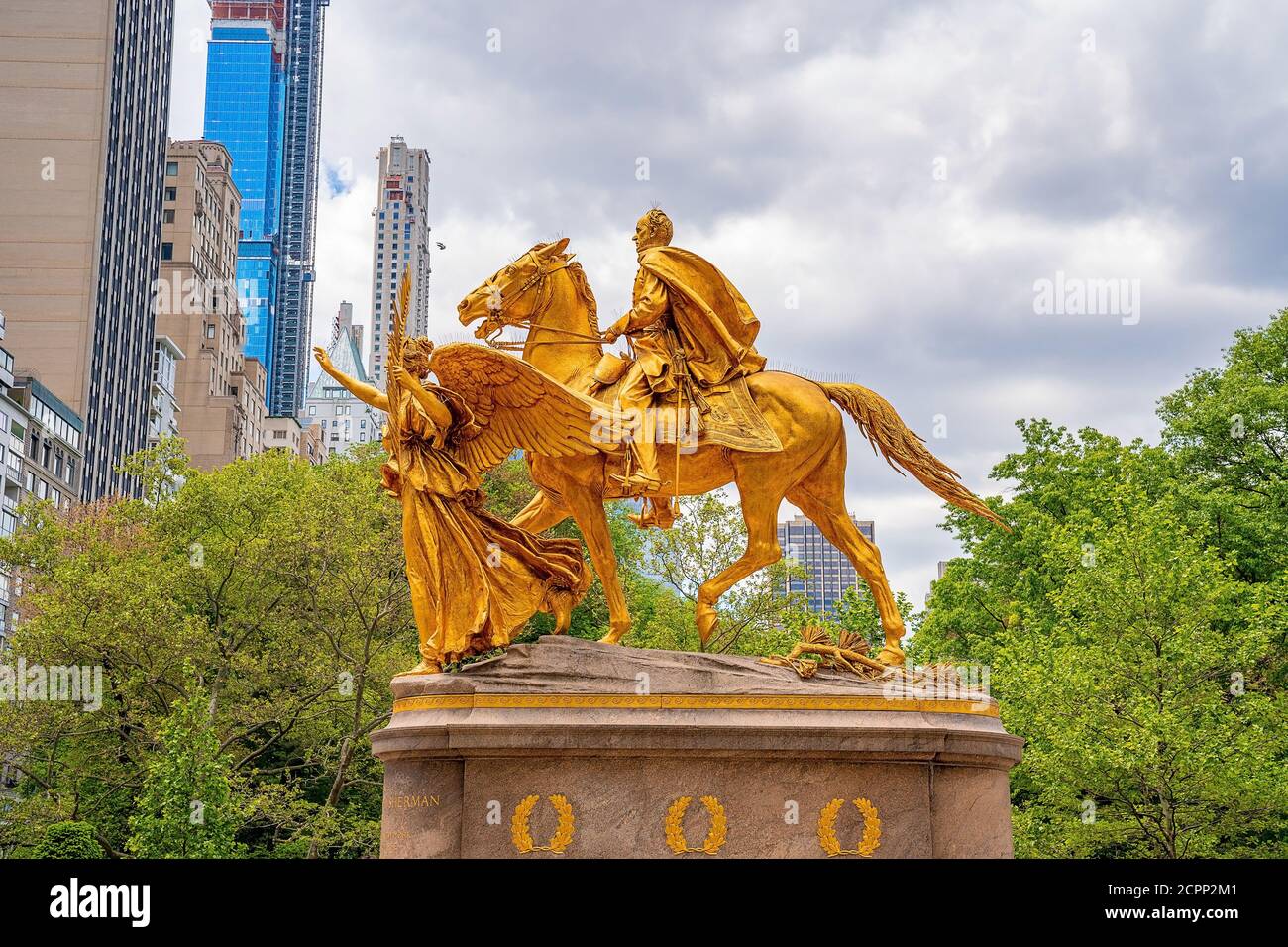 View of the gold equestrian monument at Central Park on a cloudy day ...