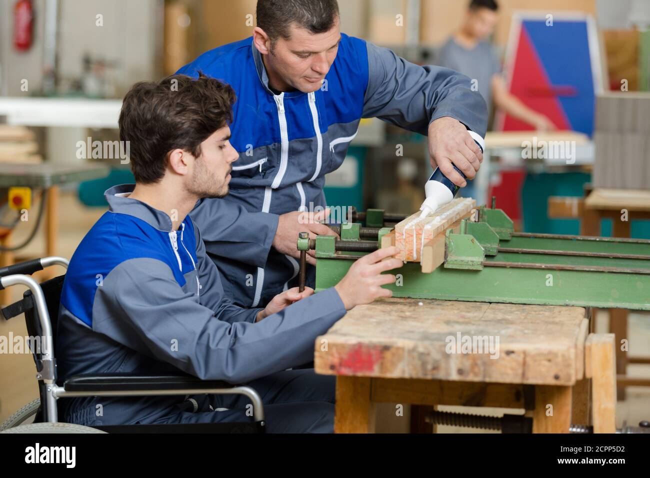carpenter putting glue on a wood Stock Photo - Alamy
