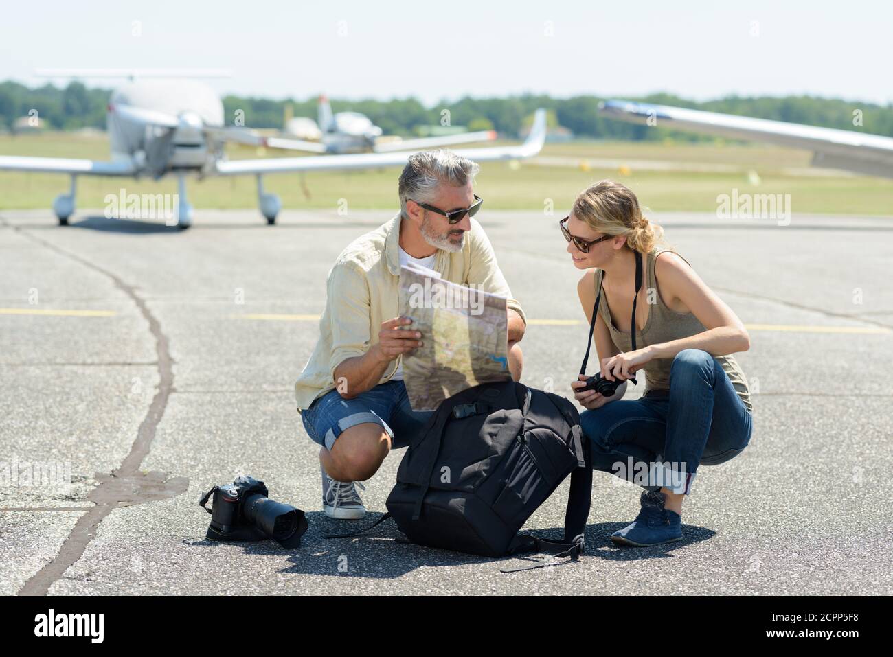 Man looking atlas hi-res stock photography and images - Alamy