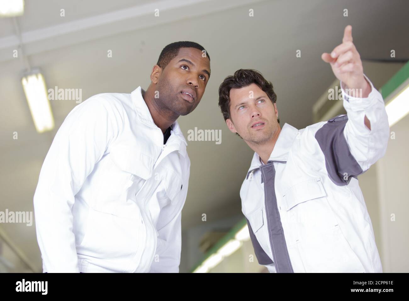 Two men hand something hi-res stock photography and images - Alamy