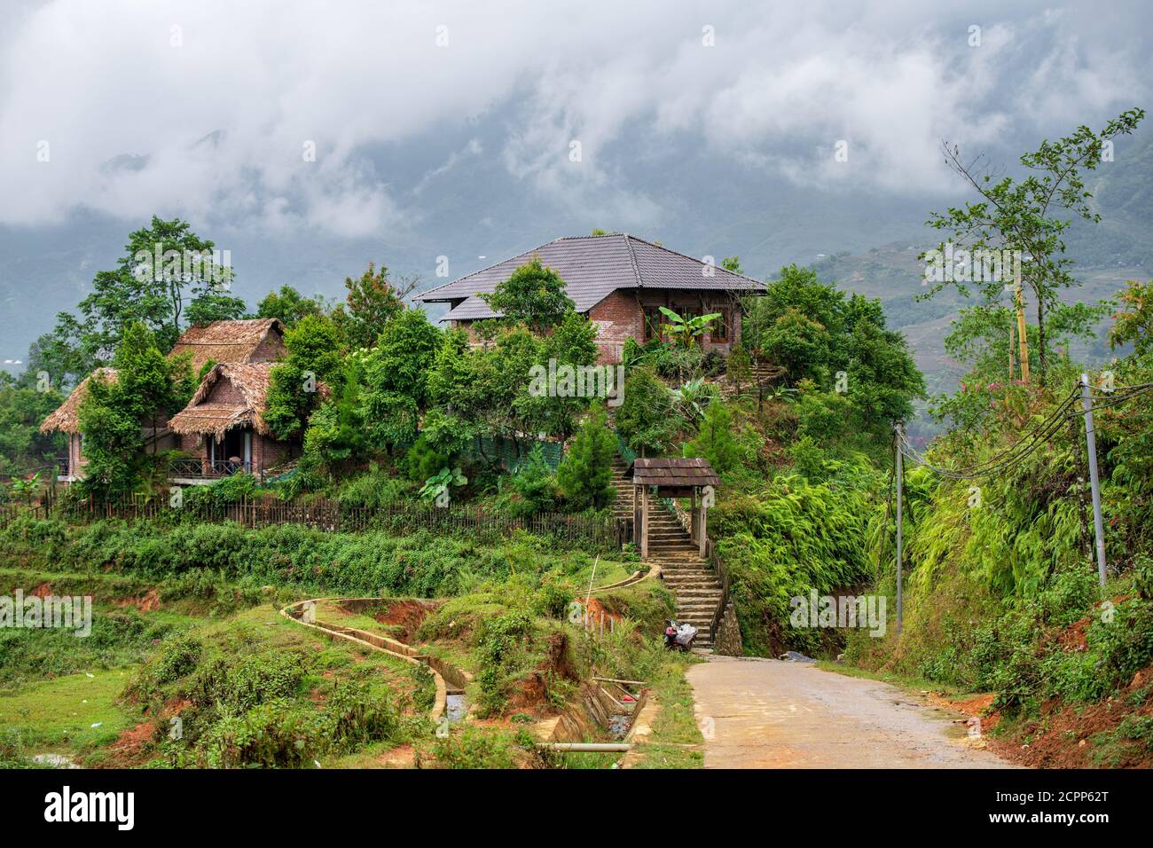 Small rural house on the side of rice paddies along Sapa dirt road in ...