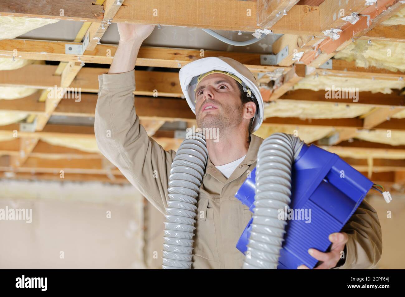 worker repairing ceiling air conditioning unit Stock Photo - Alamy