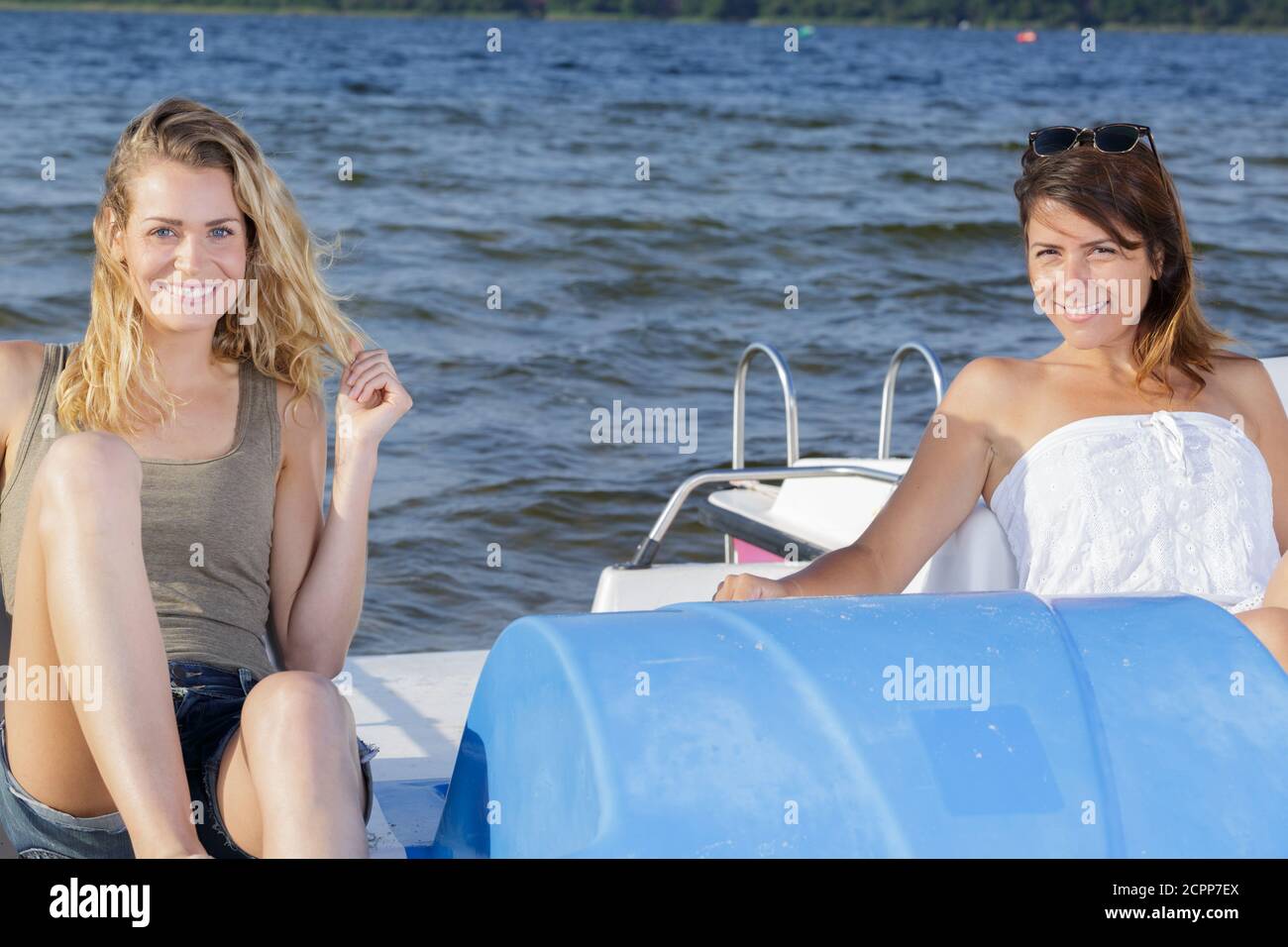 women resting on boat Stock Photo - Alamy