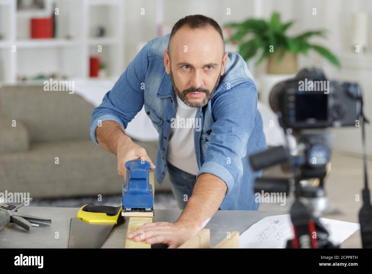 Man smoothing timber hi-res stock photography and images - Alamy