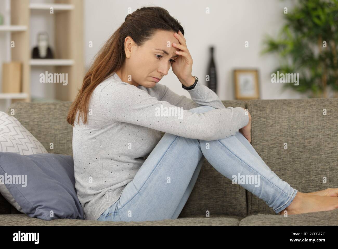 picture of woman on the sofa crying Stock Photo - Alamy
