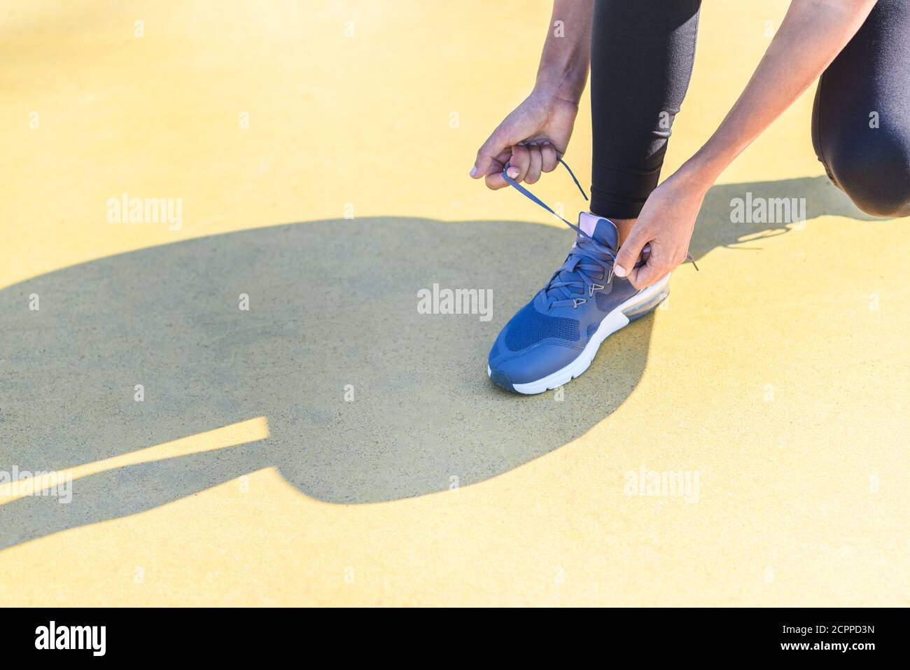 Female Athlete Tying Shoelace High Resolution Stock Photography and ...