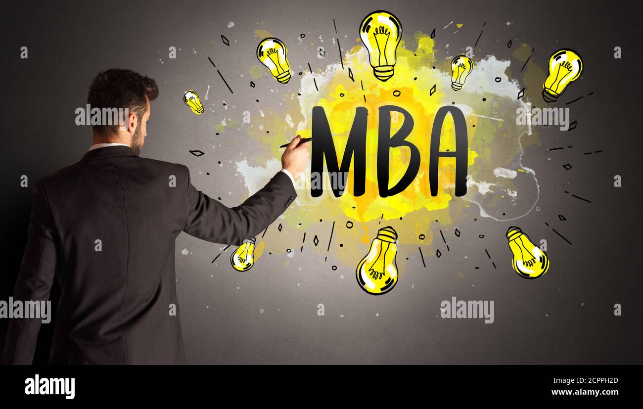 businessman drawing colorful light bulb with MBA abbreviation, new ...