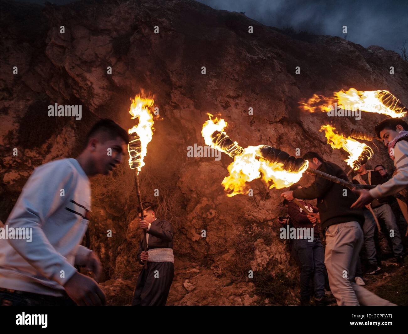 Duhok, Iraq. 21st Mar, 2018. Change stick fire during Newroz ...