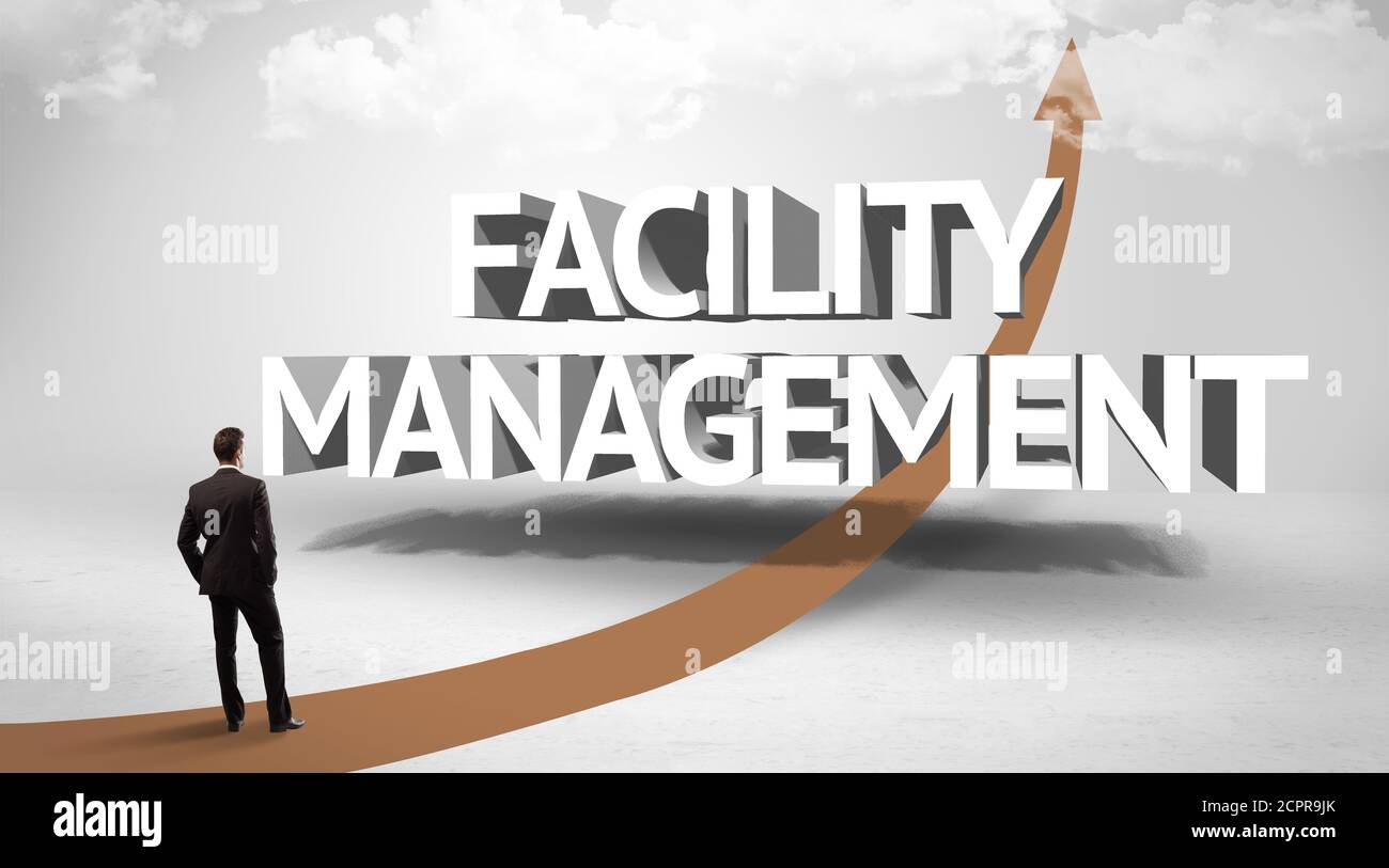 Rear view of a businessman standing in front of FACILITY MANAGEMENT ...