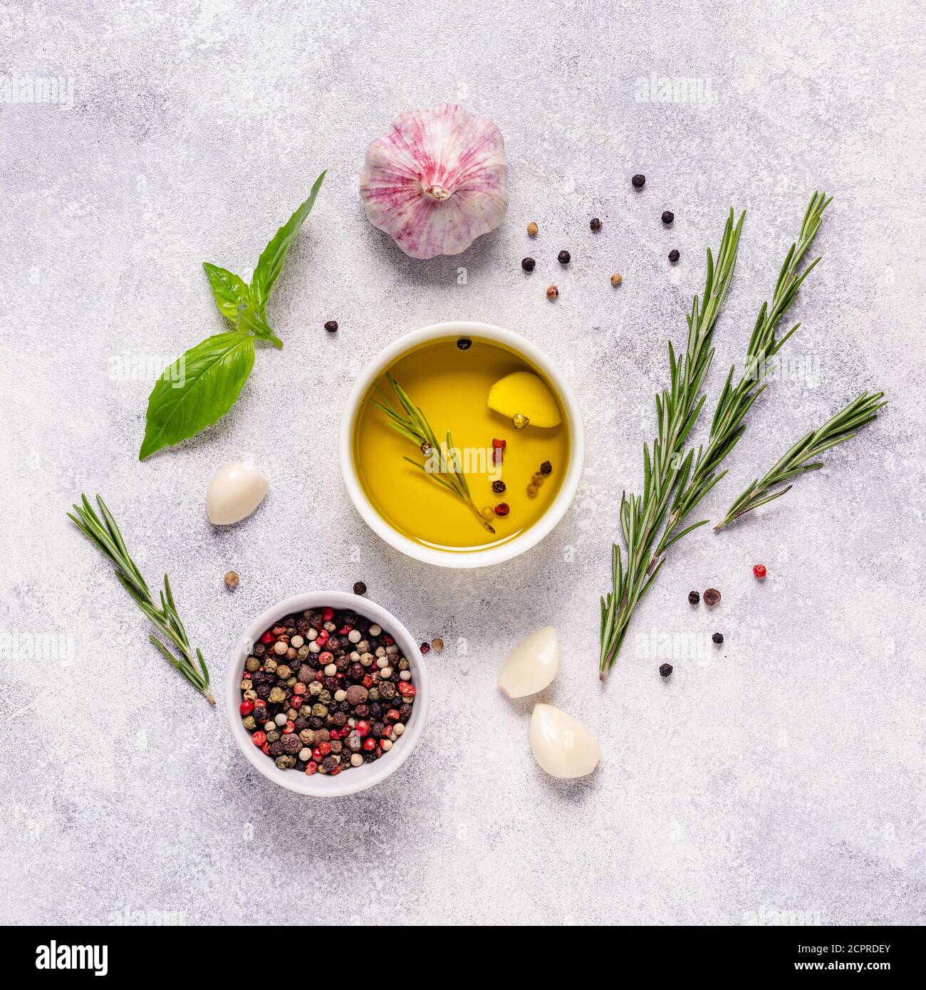 Herbs and condiments on light stone background. Top view with copy ...