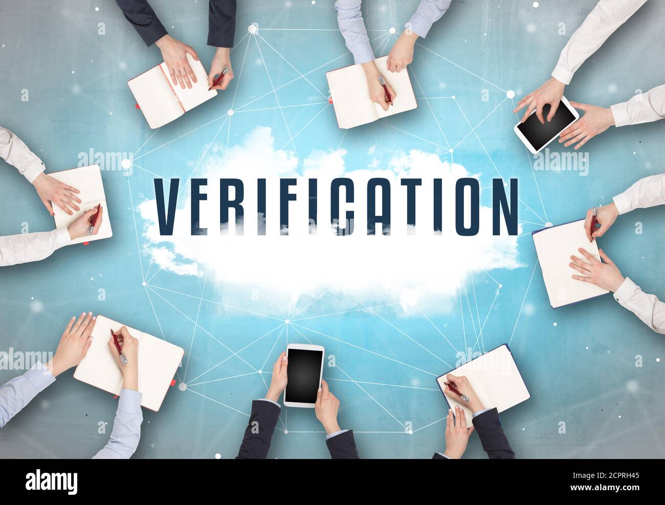 Group of people having a meeting with VERIFICATION insciption, web ...