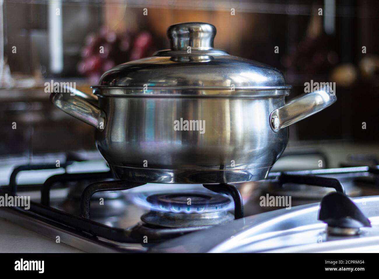 Pot on burner hi-res stock photography and images - Alamy