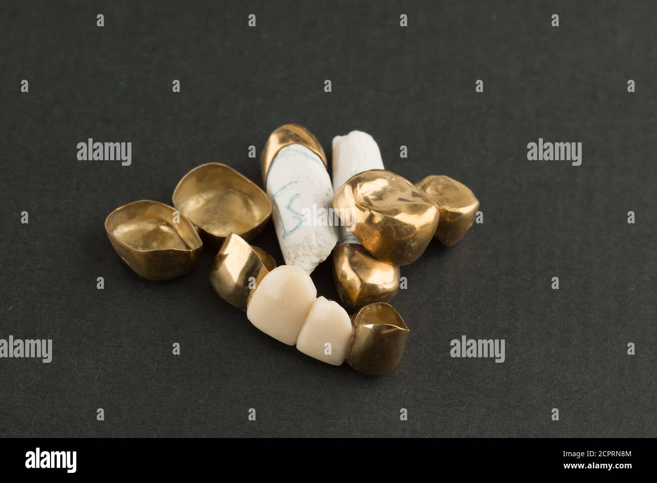stamped brazed dental bridges covered with gold coated on black ...