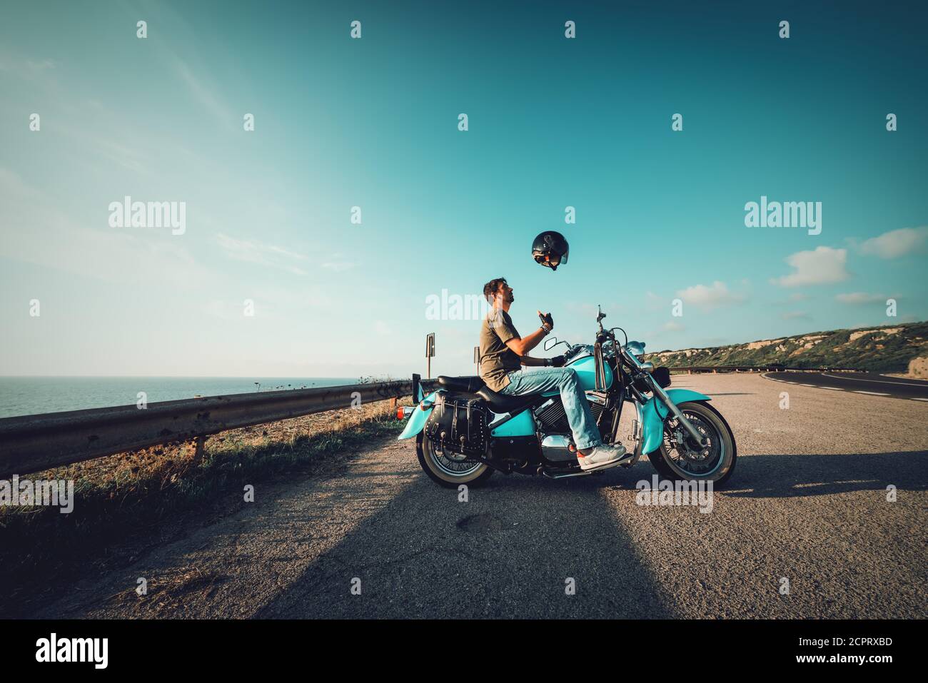 Biker on a classic motorcycle by the sea Stock Photo - Alamy
