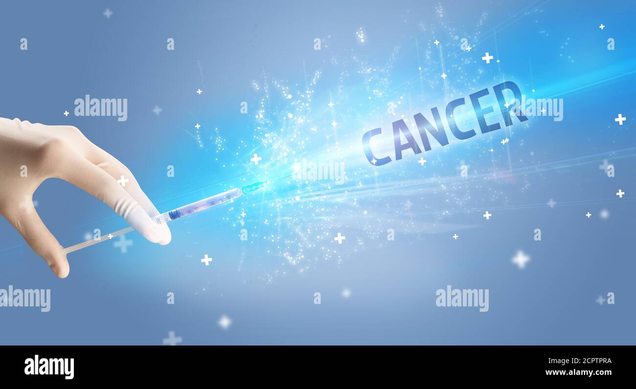 Syringe, medical injection in hand with CANCER inscription, medical ...